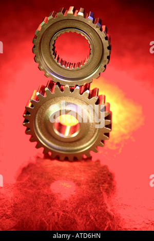 Two gears meshing together Stock Photo - Alamy