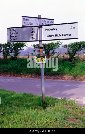 Signpost and country road Suffolk England Stock Photo - Alamy