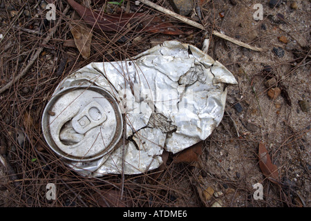 SQUASHED ALUMINIUM CAN IN DIRT Stock Photo - Alamy