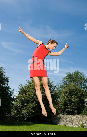 Professional gymnast woman dancer jumping with ribbon Stock Photo - Alamy