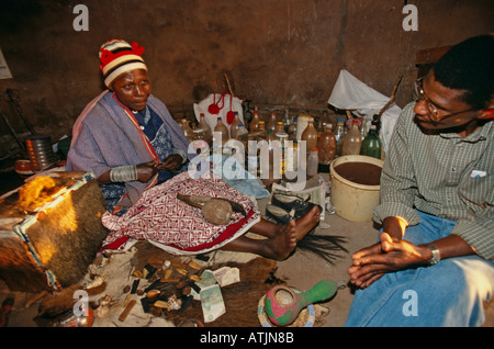 Sangoma (traditional healer) sitting in front of house, Lesotho, Africa Stock Photo - Alamy