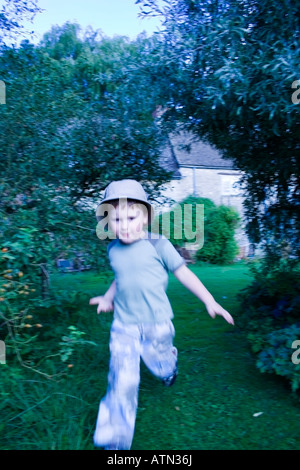 Boy running fast towards camera very determined Stock Photo - Alamy