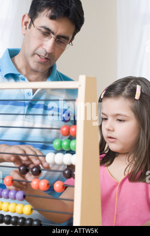child, learning and father teaching with abacus together for ...