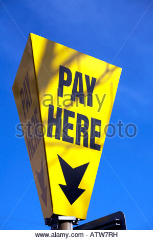 Fee - yellow sign with blue sky background Stock Photo - Alamy