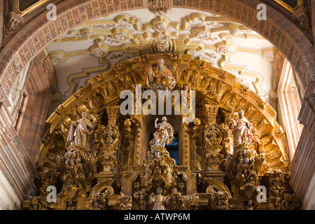 MEXICO Valenciana Gilded retablos around altar burning candles crucifix ...
