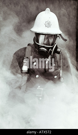 Fireman wearing oxygen breathing apparatus take part in a general ...