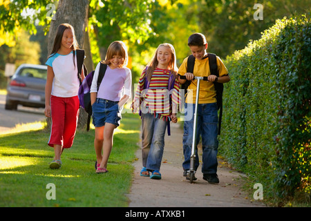 A group of students walks home from school with their books and Stock ...