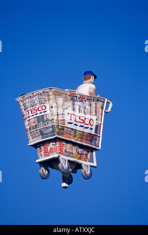 Inflated Tesco hot air balloons on the ground before take off at dawn ...