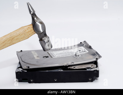 A hammer smashing a hard disk Stock Photo - Alamy