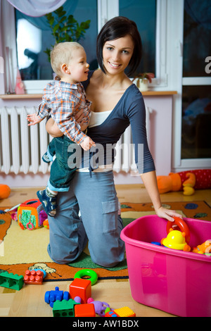 Toddler baby holding on to the radiator, child hand on the heating ...