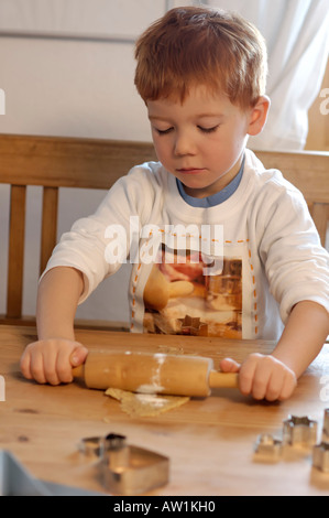 Boy bakes cookies Stock Photo - Alamy