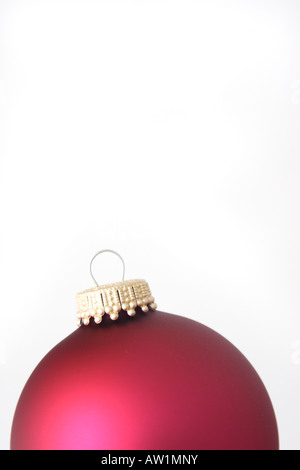 Single red frosted bauble with gold ribbon on a white background Stock ...