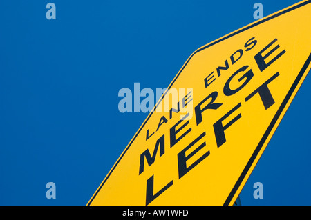 Lane ends Merge Left Traffic Signs Stock Photo - Alamy