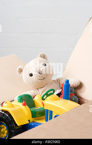 Teddy bear in a cardboard box Stock Photo - Alamy