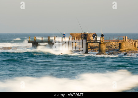 Fishing from the rocks Uvongo beach South Africa Stock Photo - Alamy