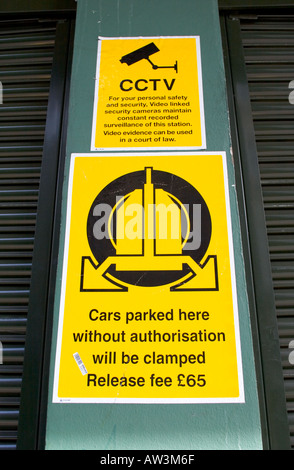 Warning sign , wheel-clamp area, Singapore Stock Photo - Alamy