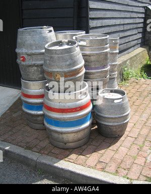 Aluminium beer real ale,lager kegs (barrels) stacked on the pavement in ...
