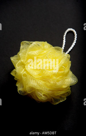A yellow lufa on a black background Stock Photo - Alamy