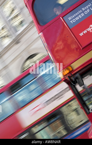 Red London bus passing by along Oxford Street in the city centre of ...