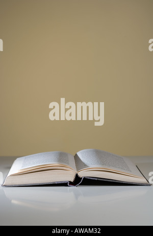 Open book lying on the table in the public library Stock Photo - Alamy