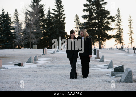 Two people walking through cemetery, Wales, UK Stock Photo: 49826622 ...