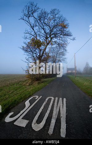 Road with slow sign perspective, distance, vanishing point Stock Photo ...