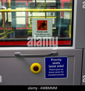 sign for priority seats on a bus for disabled customers in the uk Stock ...