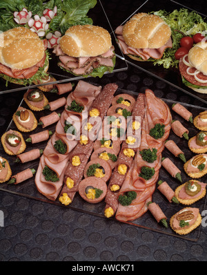 Kaiser rolls with ham and cheese on wooden board Stock Photo - Alamy