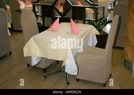 Tables setup for dinner in a hotel Stock Photo - Alamy