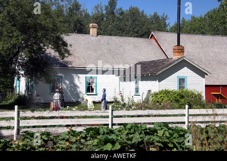 An historic house and barn together at the Mennonite Heritage Village ...