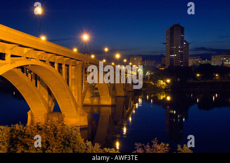 broadway bridge over the south saskatchewan river in winter flowing ...