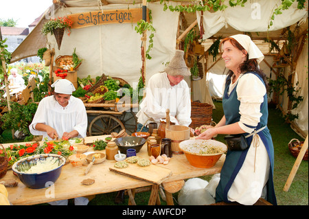 Peasants preparing a meal during a medieval festival, Burghausen, Upper ...