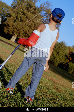 Asian boy with broken arm who wants to play baseball Stock Photo - Alamy