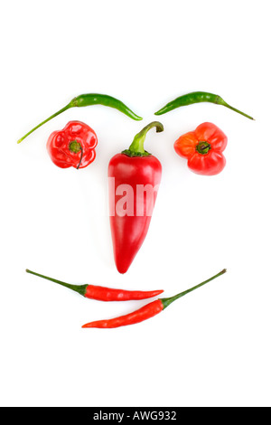 Yellow Red green chillies freshly harvested on pale blue background ...