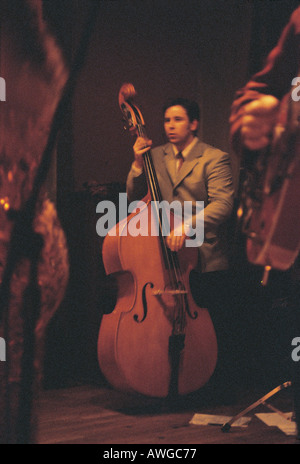 Man playing a wooden double bass on a classical concert Stock Photo - Alamy