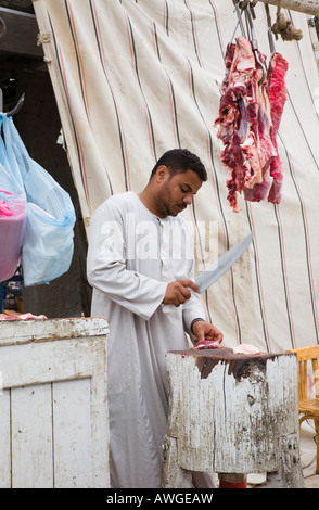 Egyptian butcher at work cutting meat in Old Sharm Sinai, Egypt Stock ...