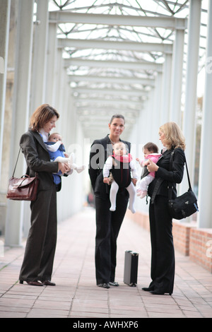 Three business women with their babies going to work manager executive ...