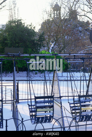 Shot of park swing covered with snow Stock Photo - Alamy