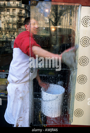 Man washing a shop window Stock Photo - Alamy