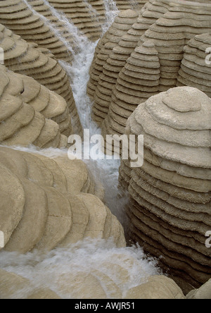 Streams of water running over stone wall Stock Photo - Alamy