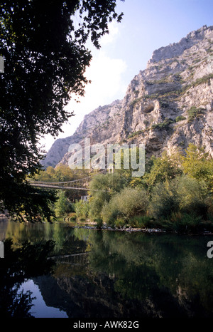 Greece. Vale of Tempi, Thessaly. Pineios River brown water flowing ...