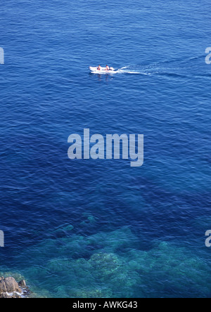 High angle view of a motor boat sailing on a vast blue sea near Koper ...