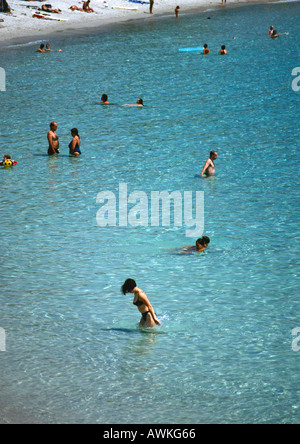 People wading in sea off Eastbourne beach Stock Photo - Alamy
