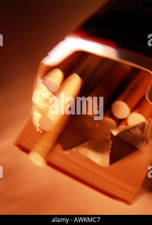 close-up view of a group of cigarettes isolated on a white background ...
