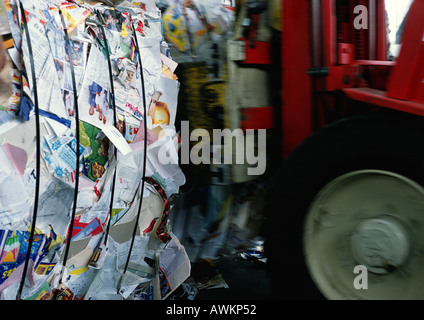Forklift moving bales of waste paper ready for recycling Stock Photo ...