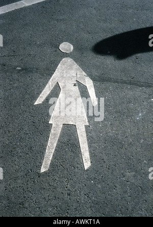 Pedestrian symbol painted on road Stock Photo - Alamy