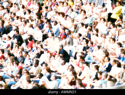 Crowd sitting in stadium, blurred Stock Photo - Alamy