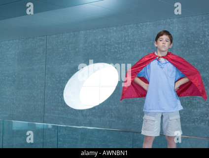 Boys wearing capes standing on meadow Stock Photo - Alamy