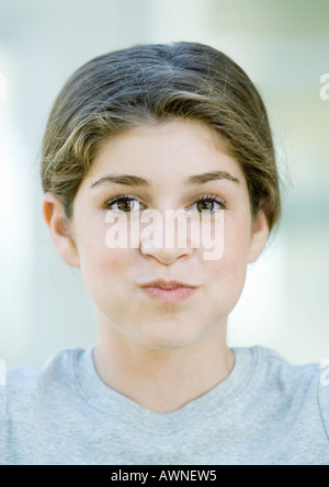 Back view of preteen girl making frame gesture at warm sunset in ...