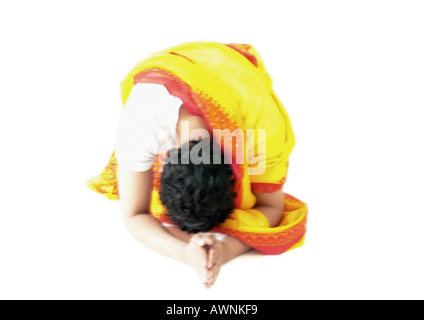 Hindu man bending over and praying Stock Photo - Alamy